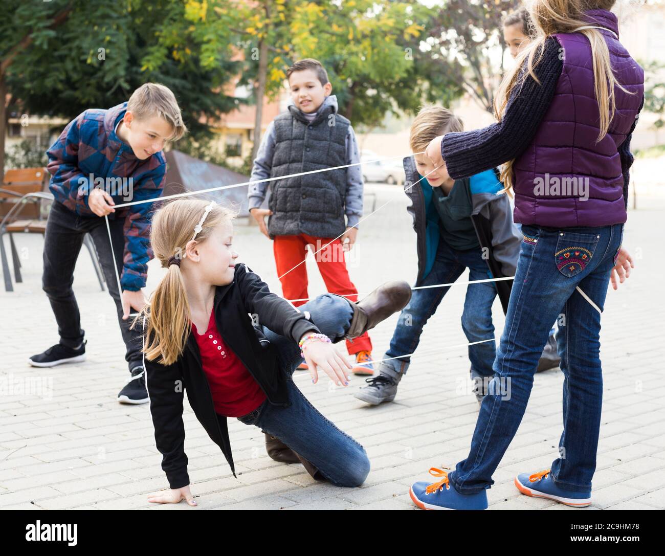 Children playing an elastic hi-res stock photography and images - Alamy