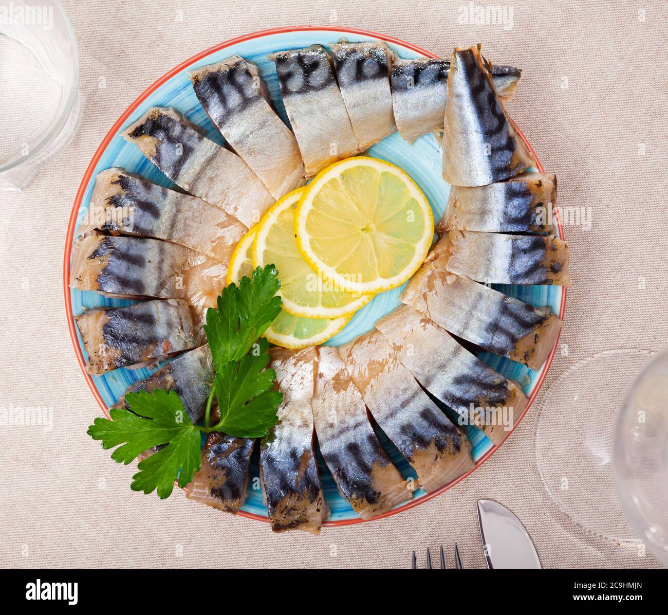 Traditional Russian appetizer of smoked mackerel fillets slices served ...