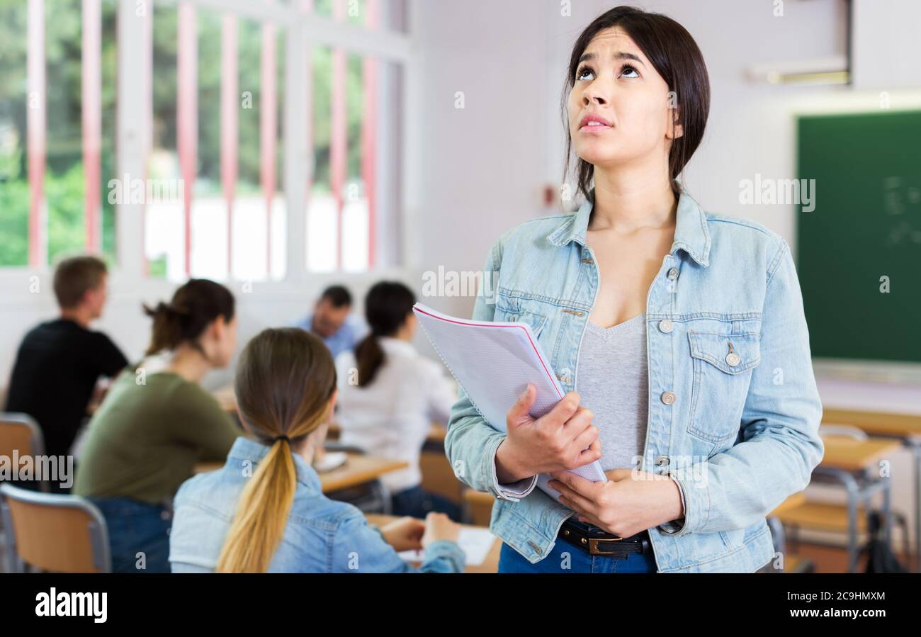 Portrait of sad schoolgirl who is dissatisfied assessment in the class ...