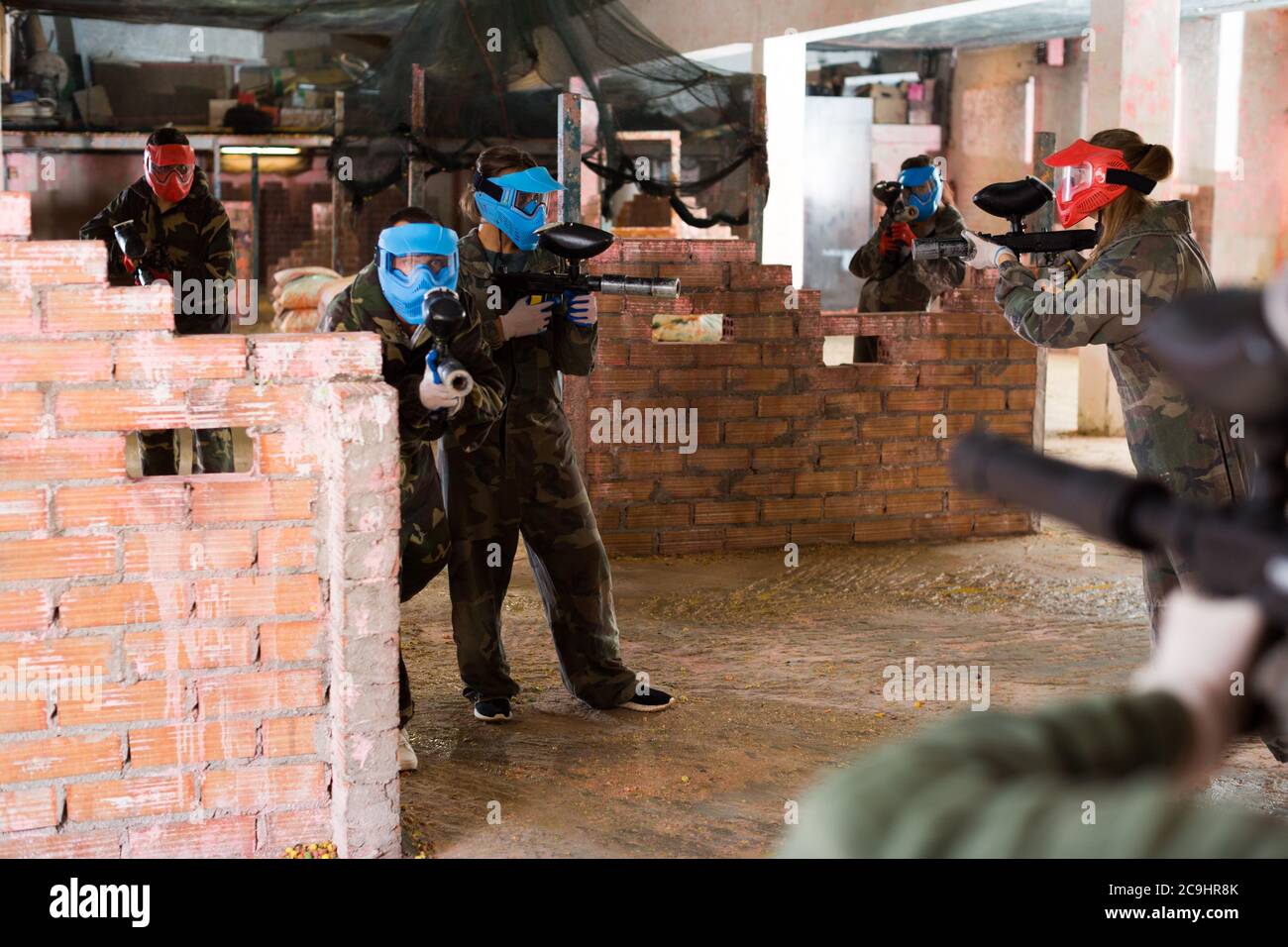 People are having fun on the battlefiled on the paintball court Stock ...