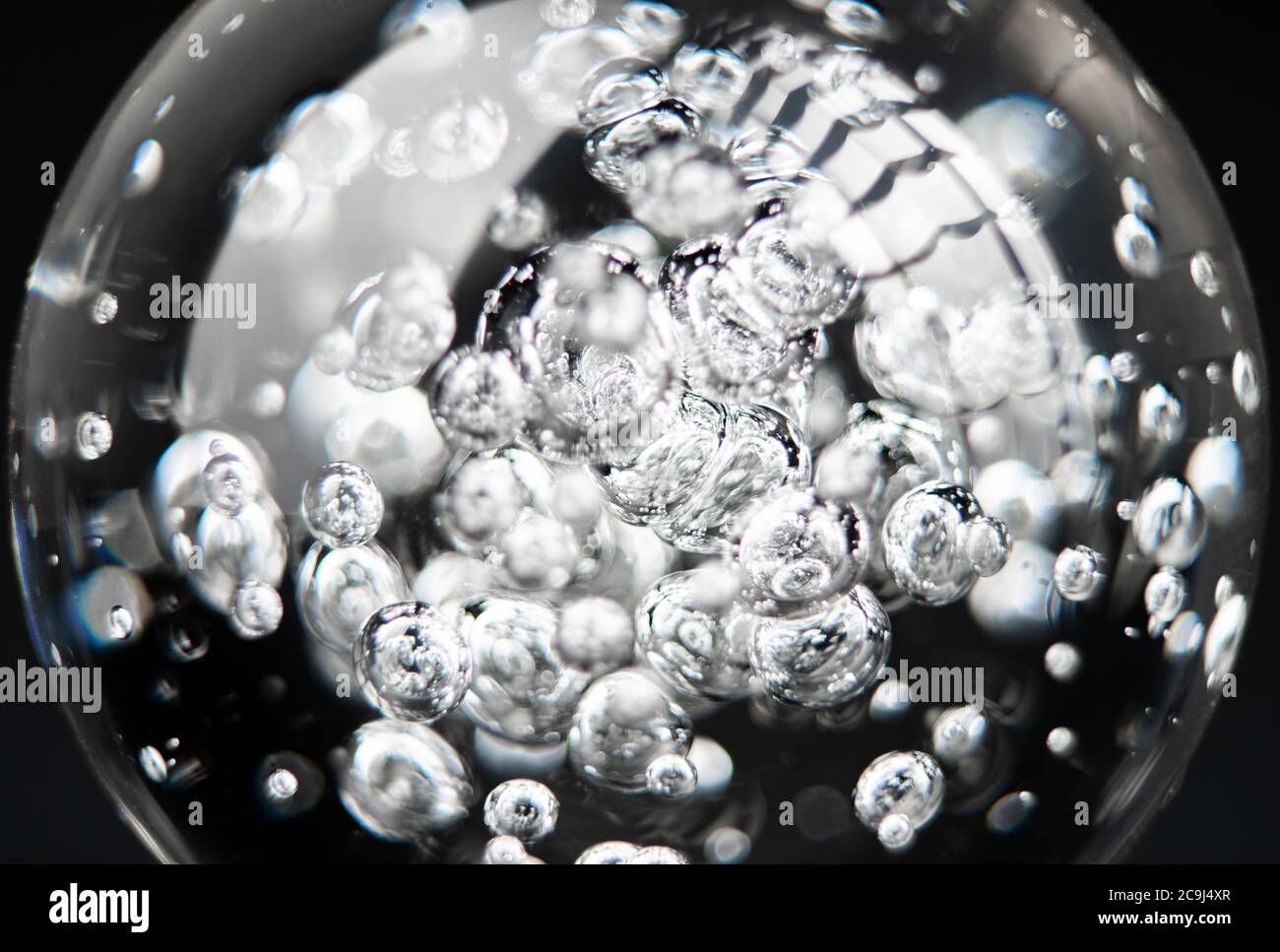 Image of bubbles in glass transparent sphere on black background Stock ...