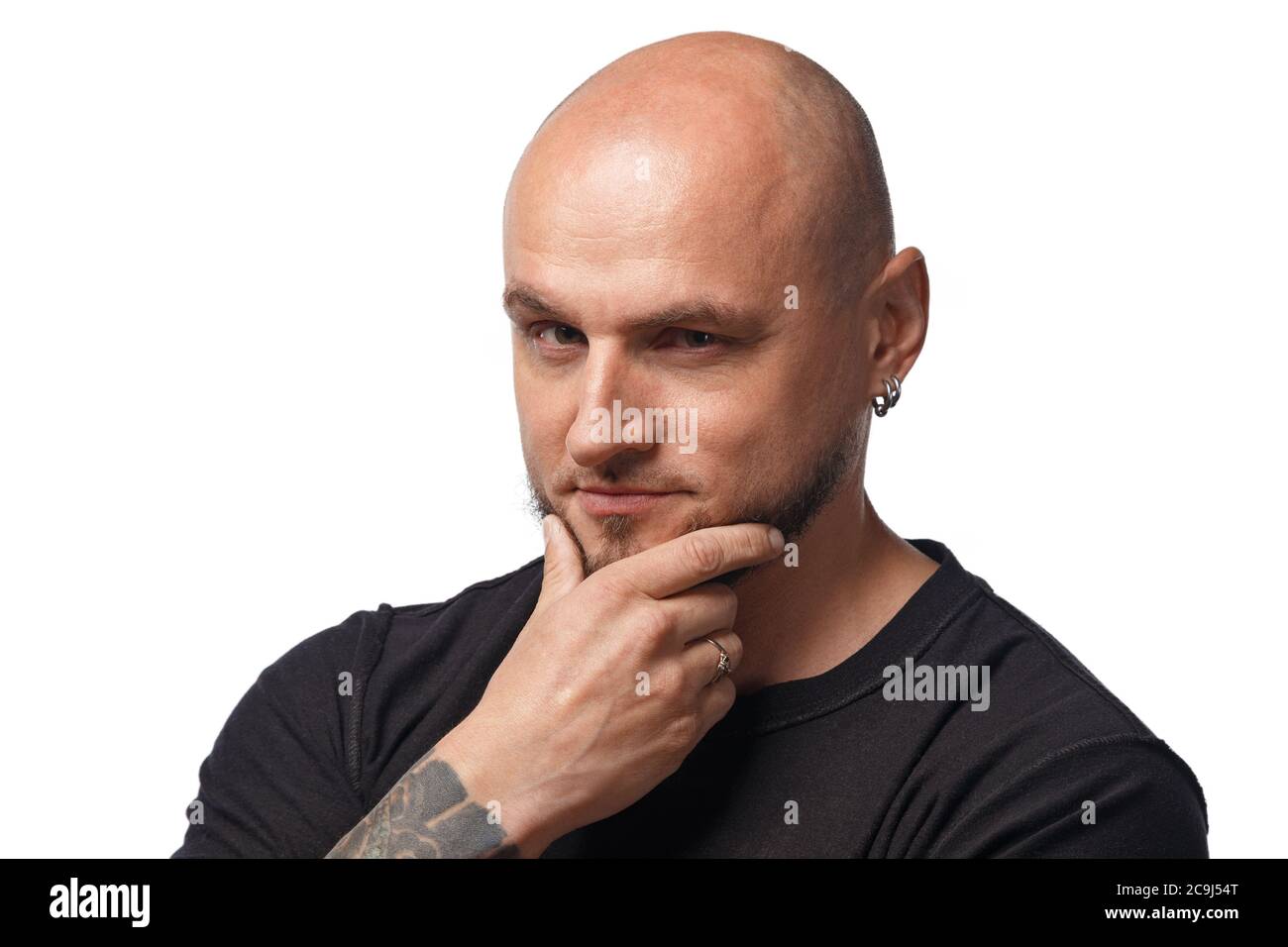 Image of bald scheming man in black shirt on white background Stock ...