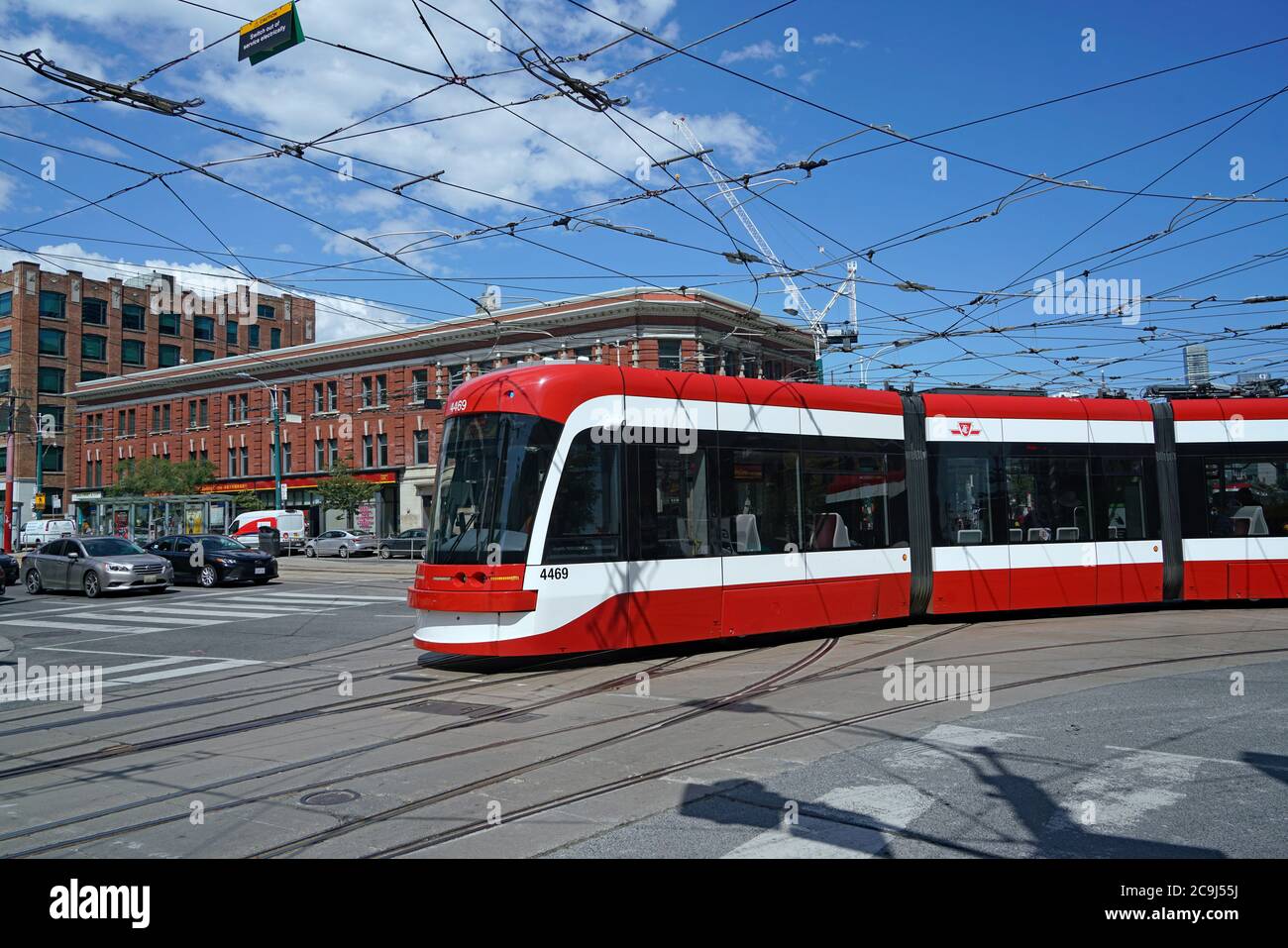 Toronto, Canada - July 31, 2020: An articulated streetcar turns the ...