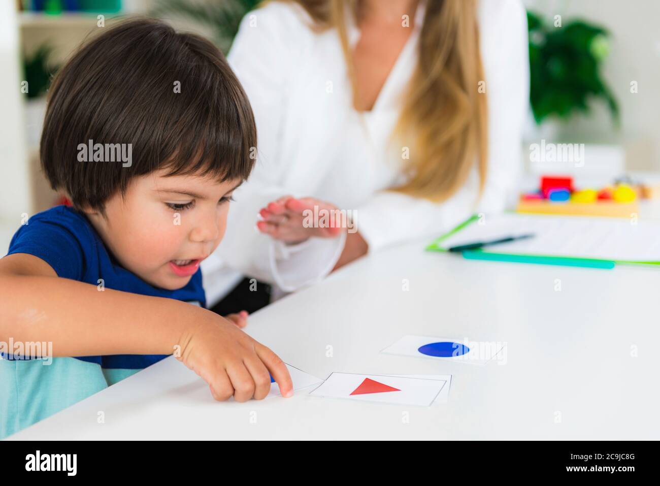 Child Psychology Toddler Doing Logic Tests With Cards Stock Photo Alamy