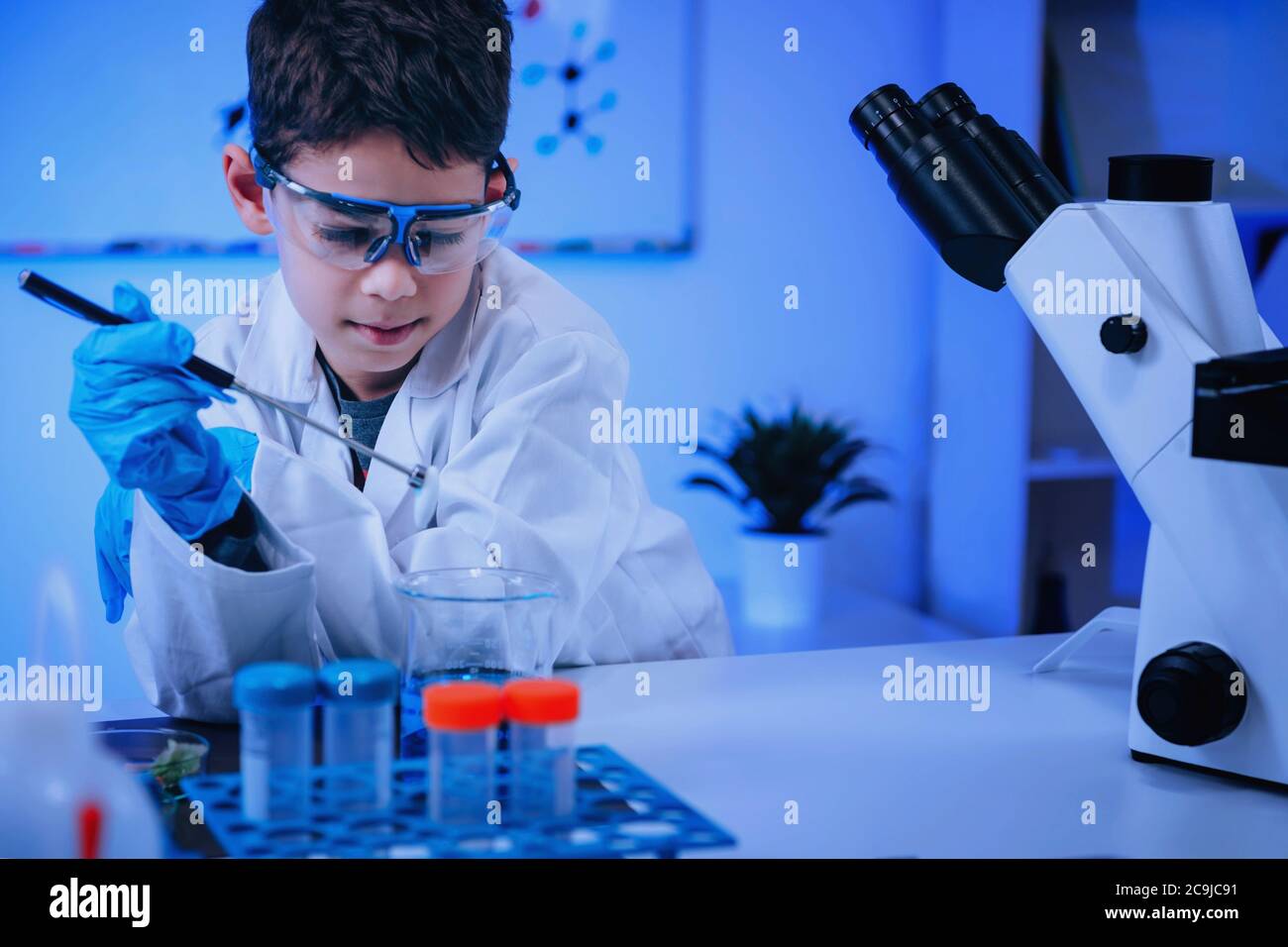 Schoolboy doing science experiment Stock Photo - Alamy