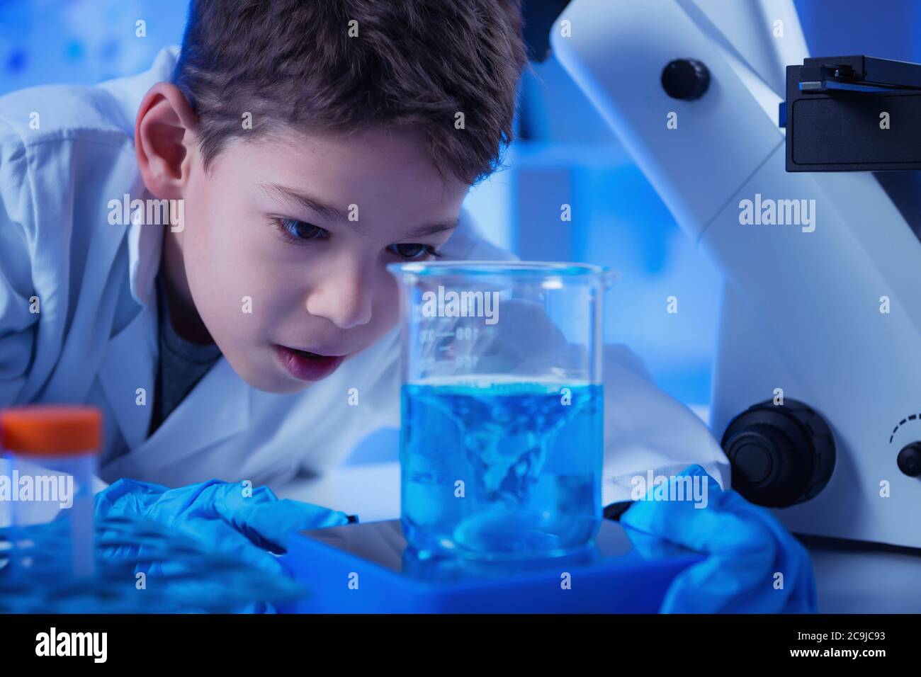 Schoolboy doing science experiment Stock Photo - Alamy
