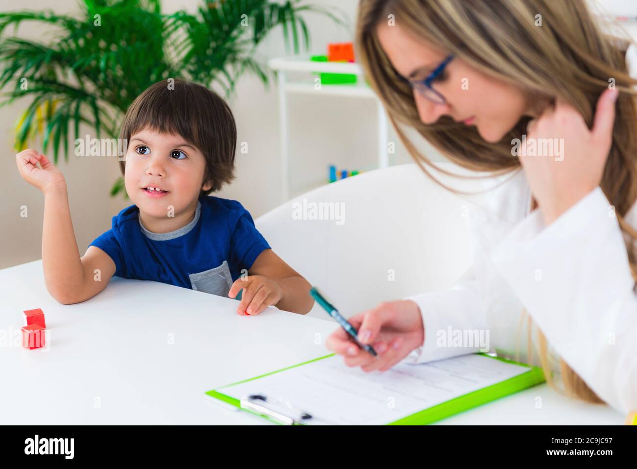 Child psychology, little boy talking to psychologist Stock Photo - Alamy