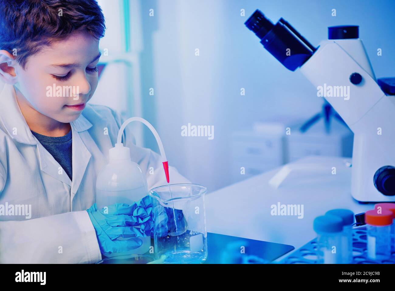 Schoolboy using lab equipment, laboratory education concept Stock Photo ...