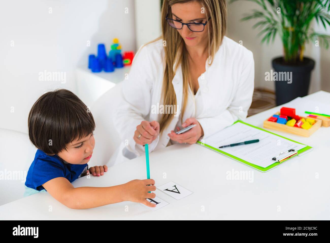 Child psychology, toddler doing logic tests with letters Stock Photo ...