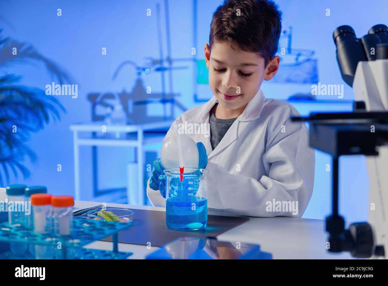 Schoolboy doing science experiment Stock Photo - Alamy