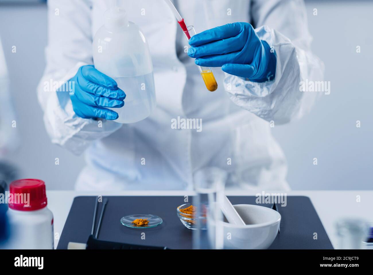 Quality control expert inspecting turmeric in the laboratory Stock ...