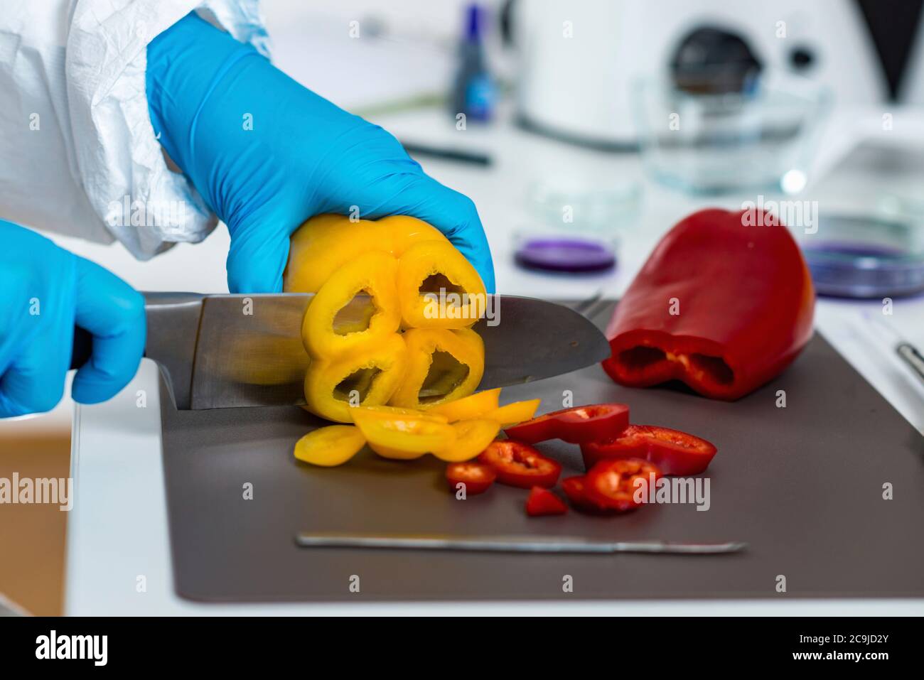 Quality control food safety inspector working with vegetables in a ...