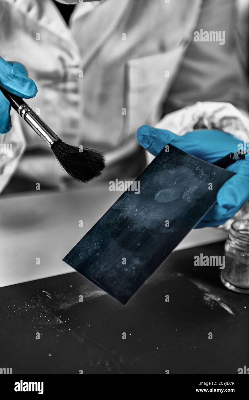 Forensic science investigator collecting fingerprints Stock Photo - Alamy