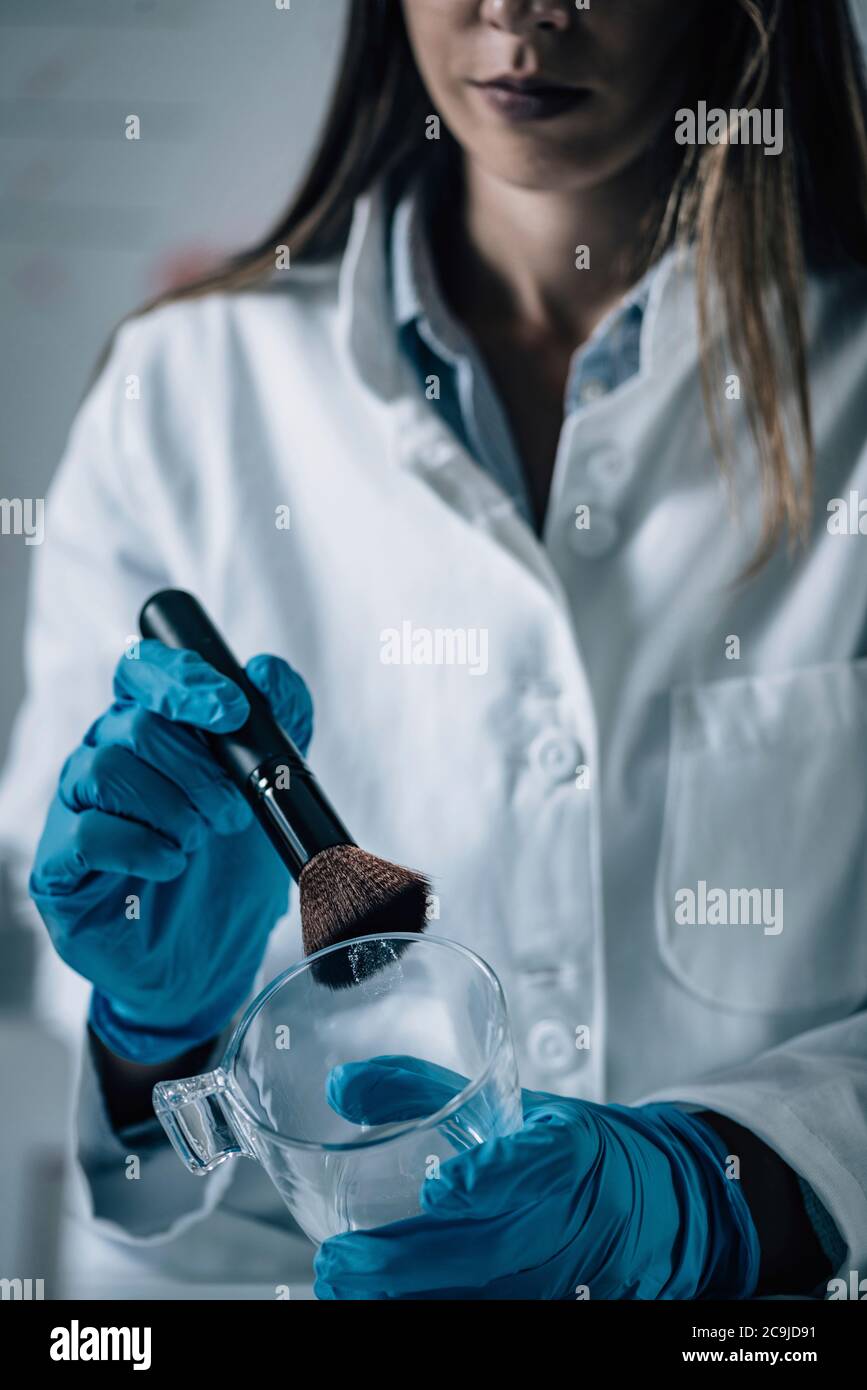 Brushing evidence hi-res stock photography and images - Alamy