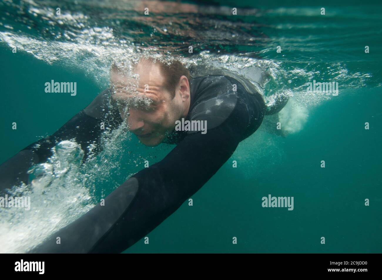 Underwater image of a young man speeding through the water Stock Photo ...