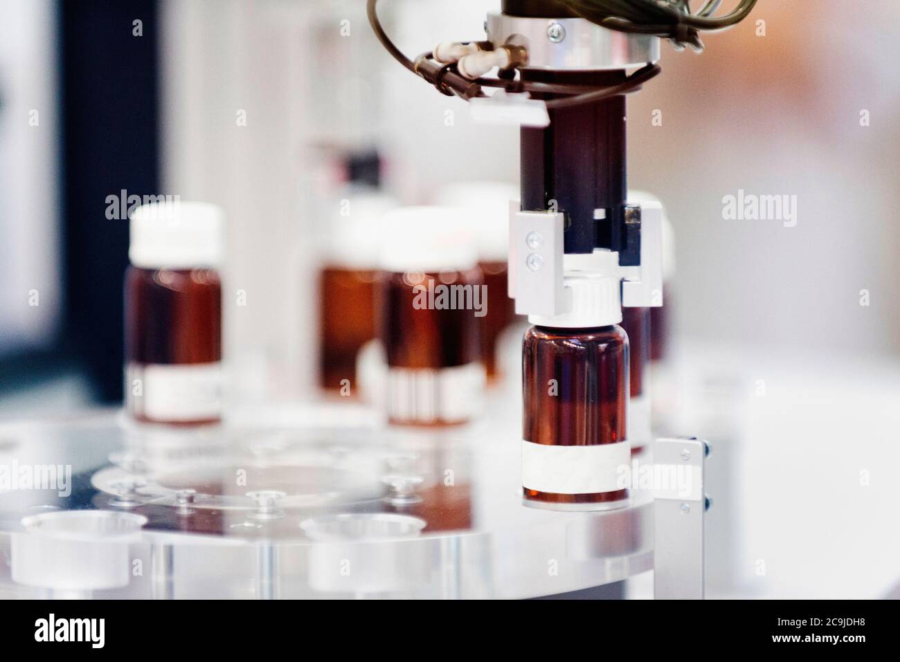 Production line in pharmaceutical company. Automated machine processing ...