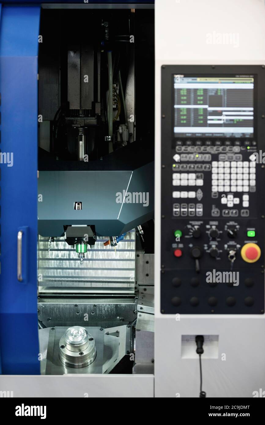 Compact automated vertical spindle machining centre Stock Photo - Alamy