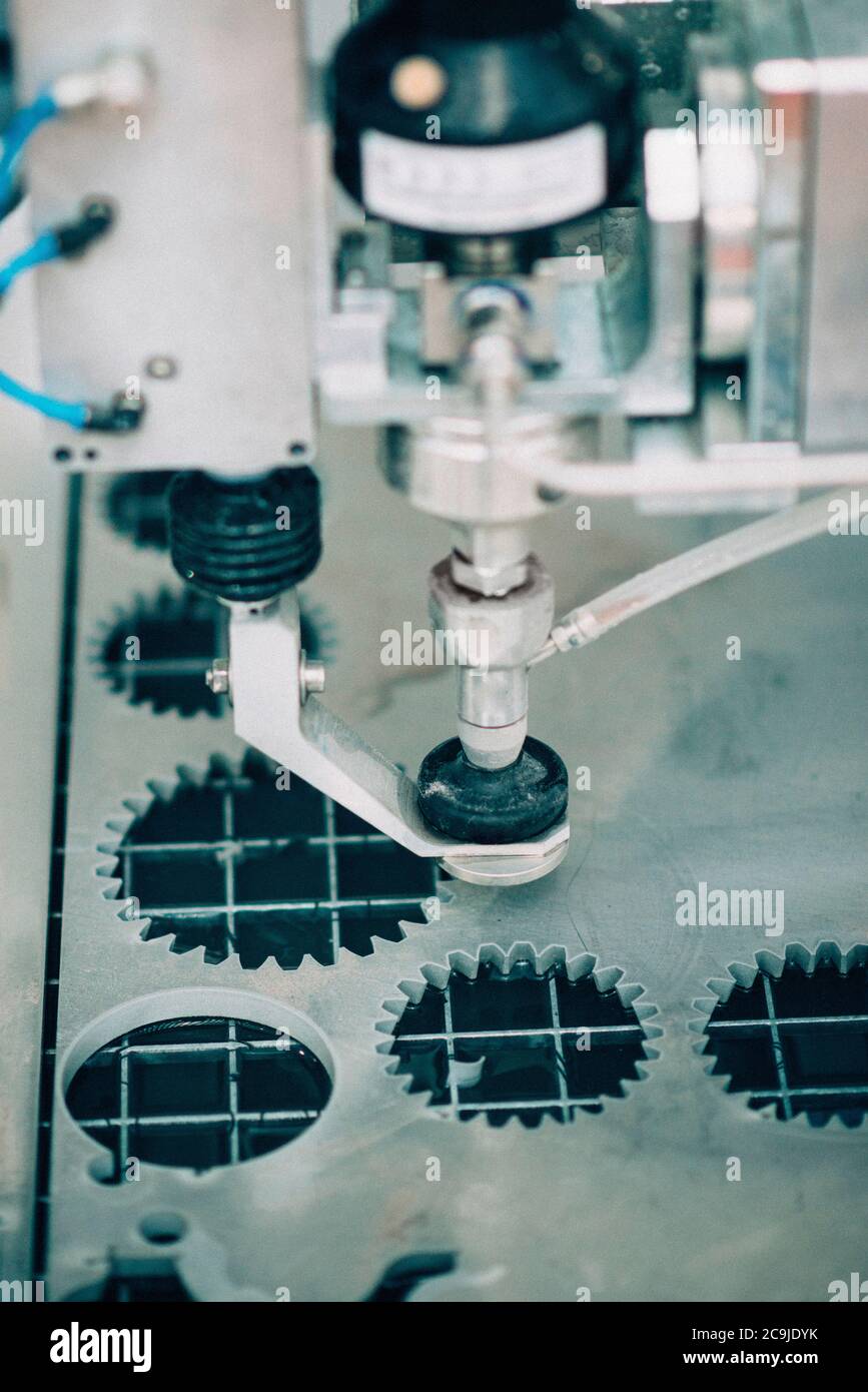 Waterjet cutting CNC machine. Using water under high pressure to pierce ...