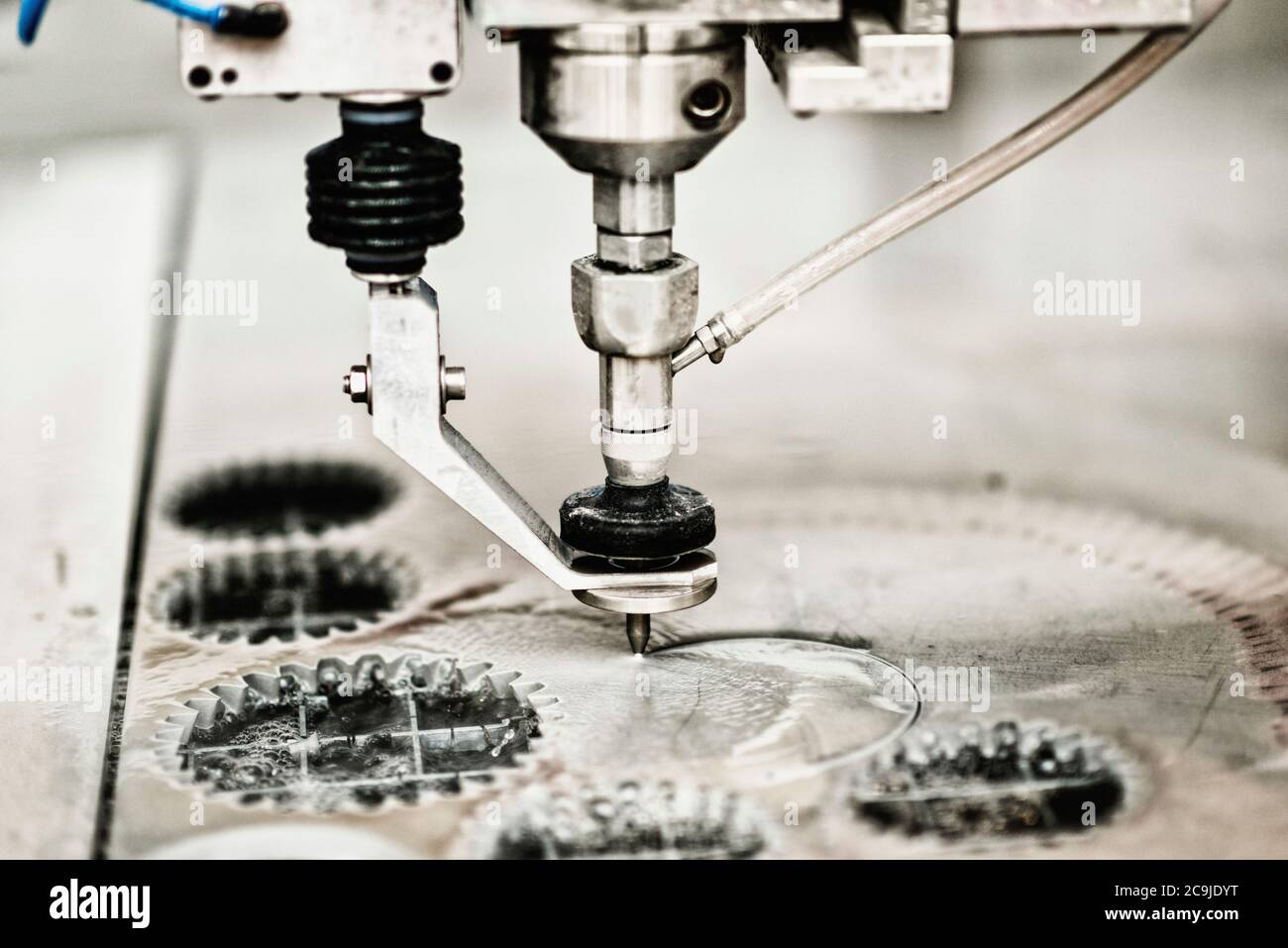 Waterjet cutting CNC machine. Using water under high pressure to pierce ...