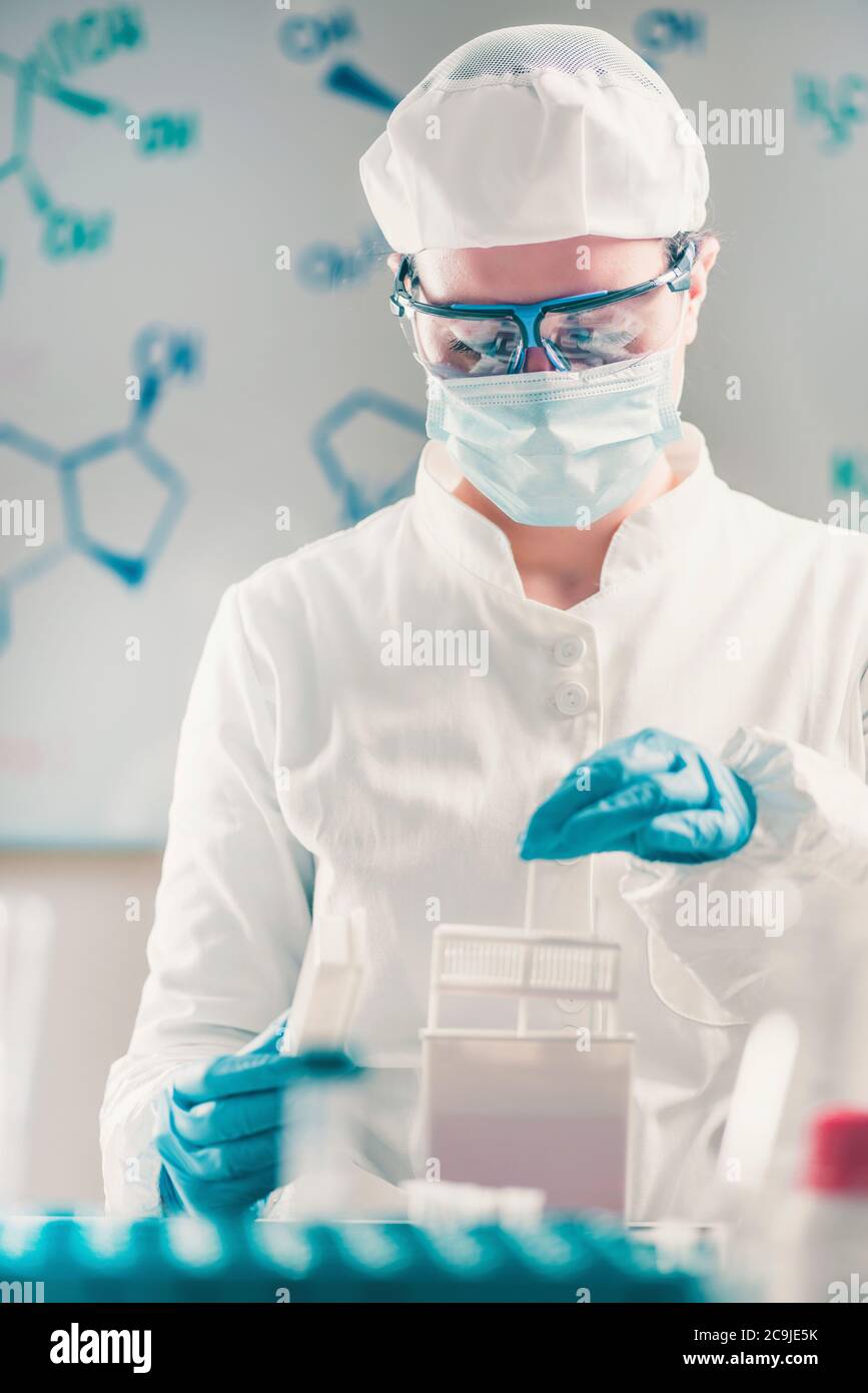 Microbiologist working in laboratory Stock Photo - Alamy