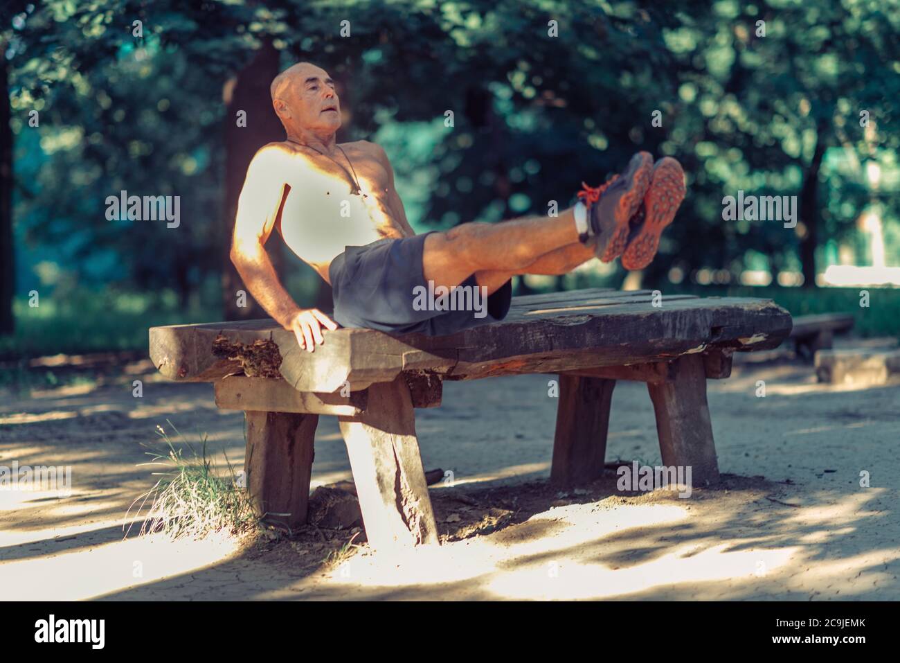 Fit senior man exercising in a park Stock Photo - Alamy