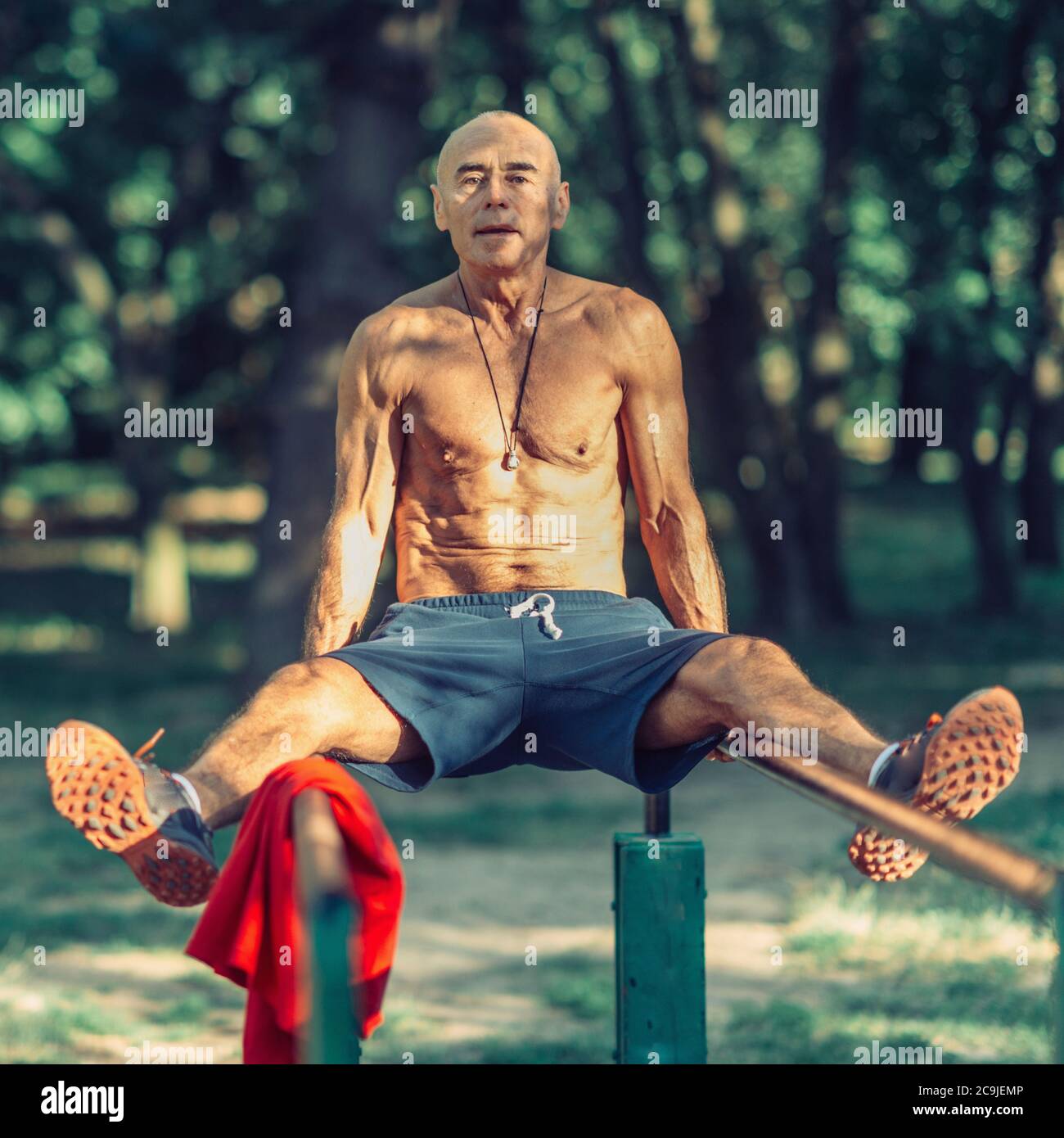 Fit senior man exercising in a park Stock Photo - Alamy