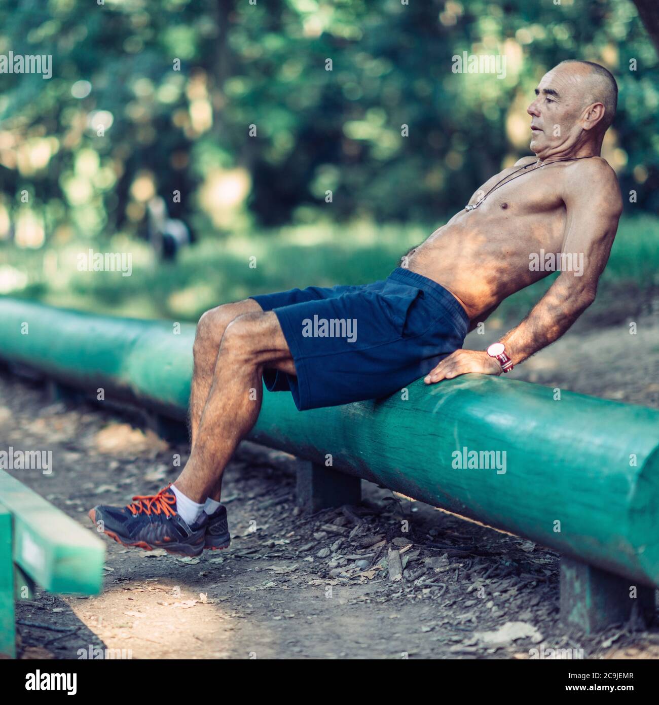Fit senior man exercising in a park Stock Photo - Alamy