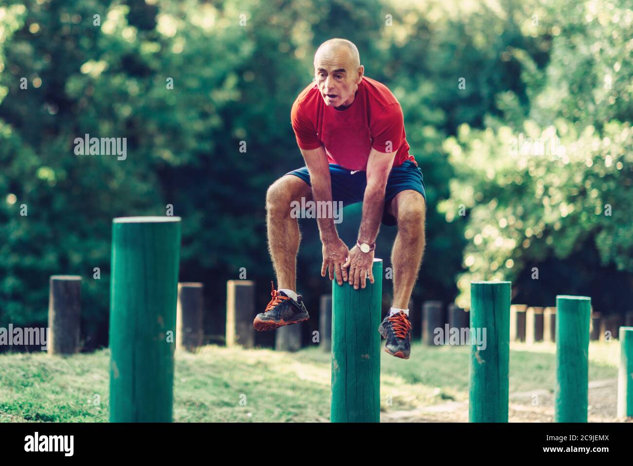 Fit senior man exercising in a park Stock Photo - Alamy