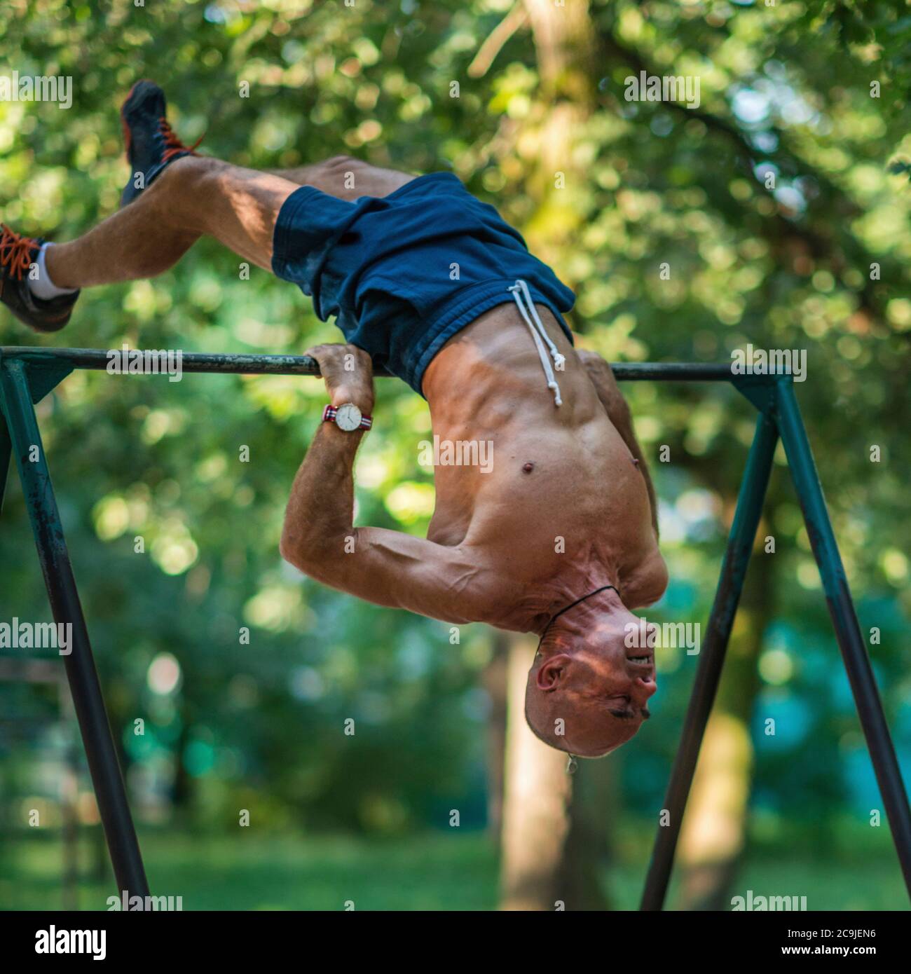 Fit senior man exercising in a park Stock Photo - Alamy