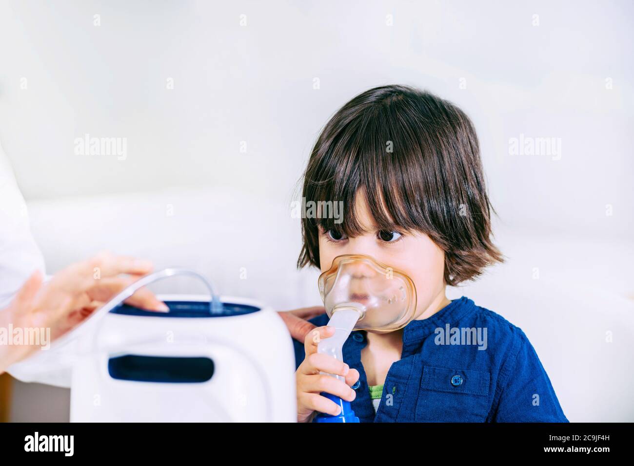 Boy using inhaler Stock Photo - Alamy