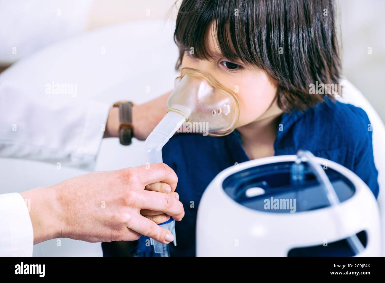 Boy using inhaler Stock Photo - Alamy