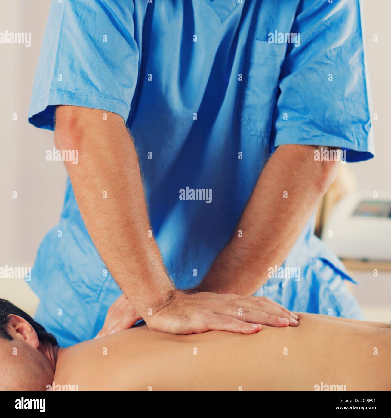 Massaging the back hi-res stock photography and images - Alamy