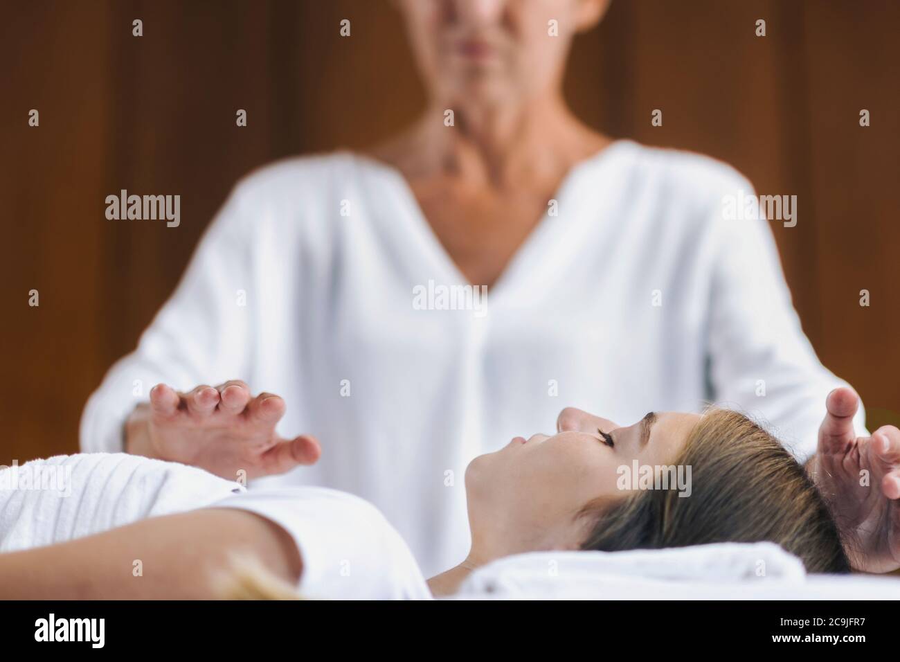 Reiki therapy. Healing and balancing heart and crown chakras Stock ...