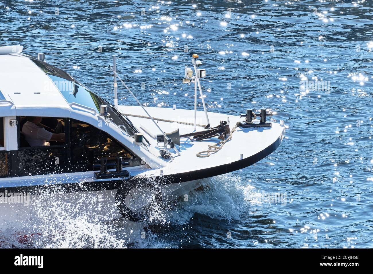 Sea boat sails with splashing water in summer Stock Photo - Alamy