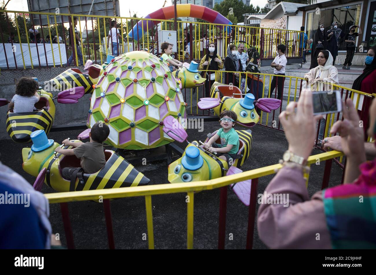 Tehran, Iran. 31st July, 2020. Children have fun at an amusement park ...