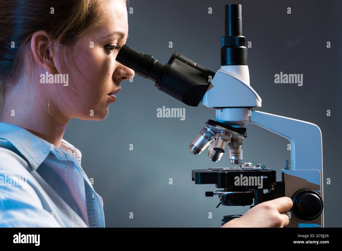 Scientist using microscope Stock Photo - Alamy