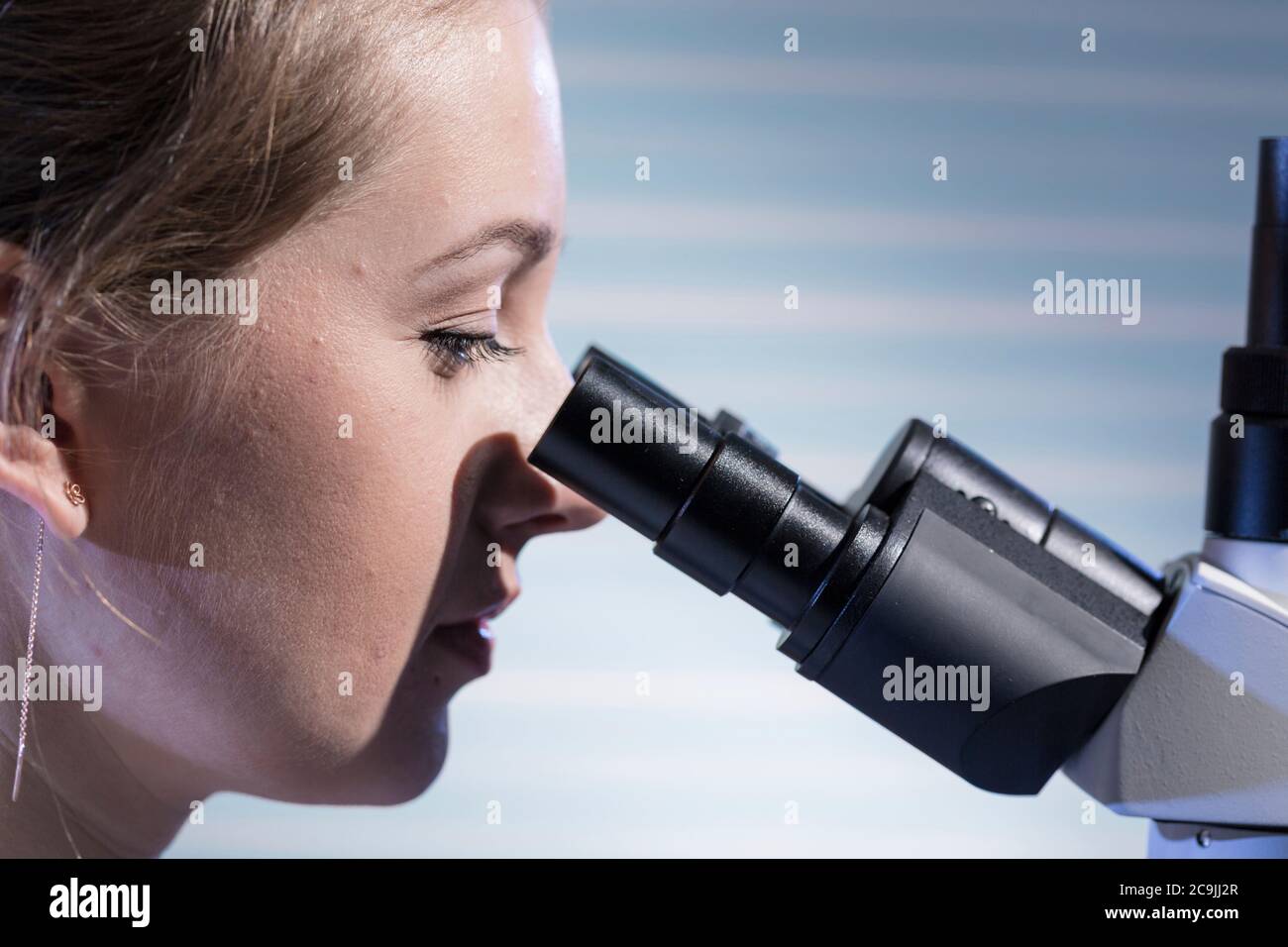 Scientist using microscope Stock Photo - Alamy