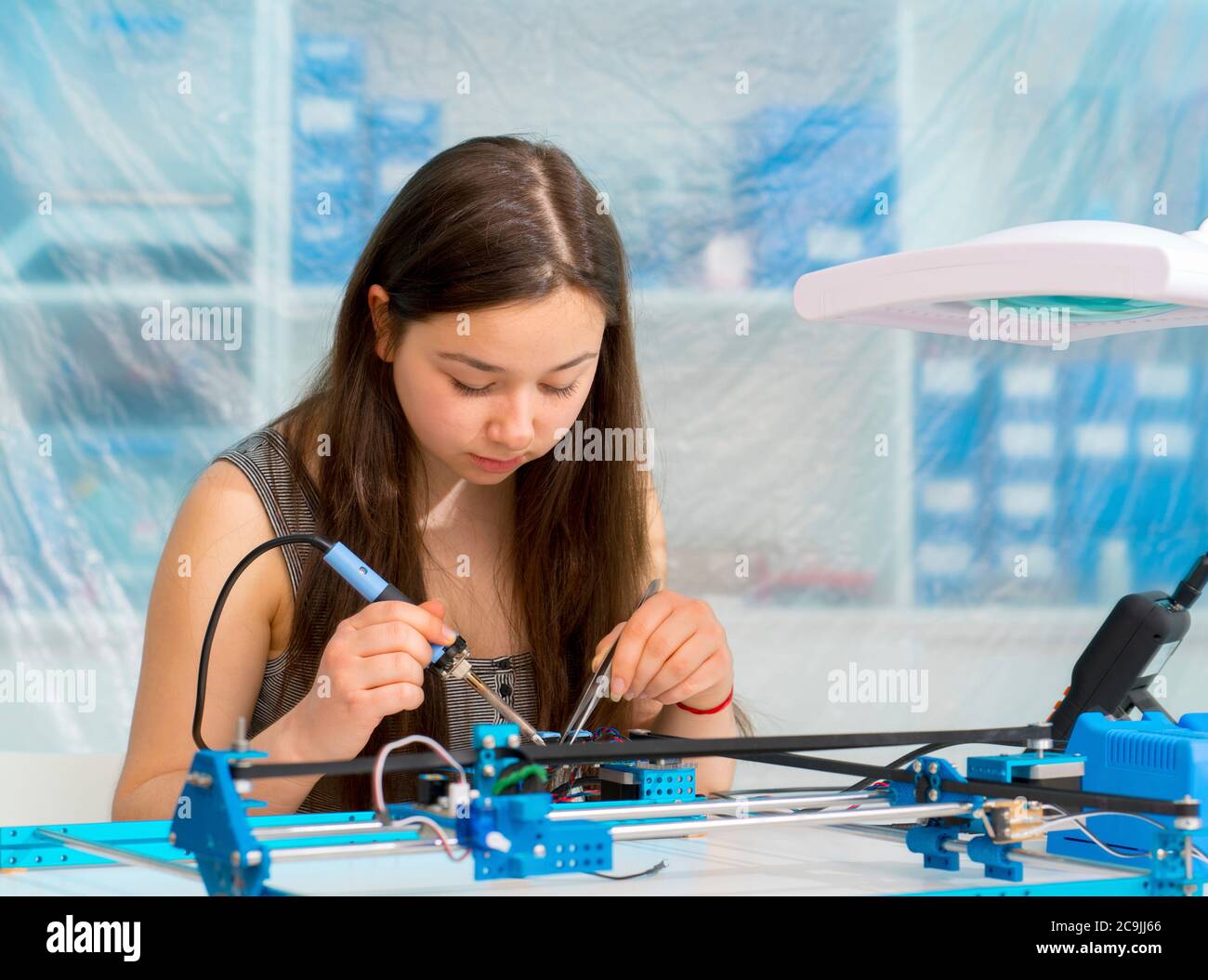 Girl working on robotics project Stock Photo - Alamy