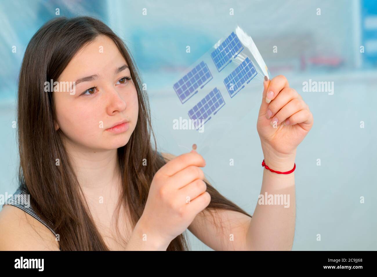 Girl working on electronics project Stock Photo - Alamy