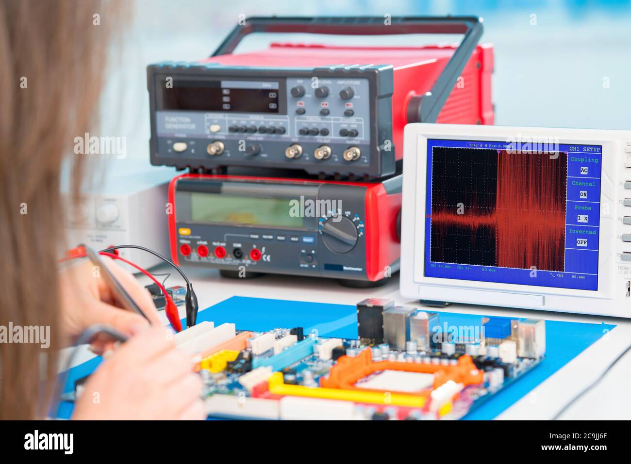 Girl working on electronics project Stock Photo - Alamy