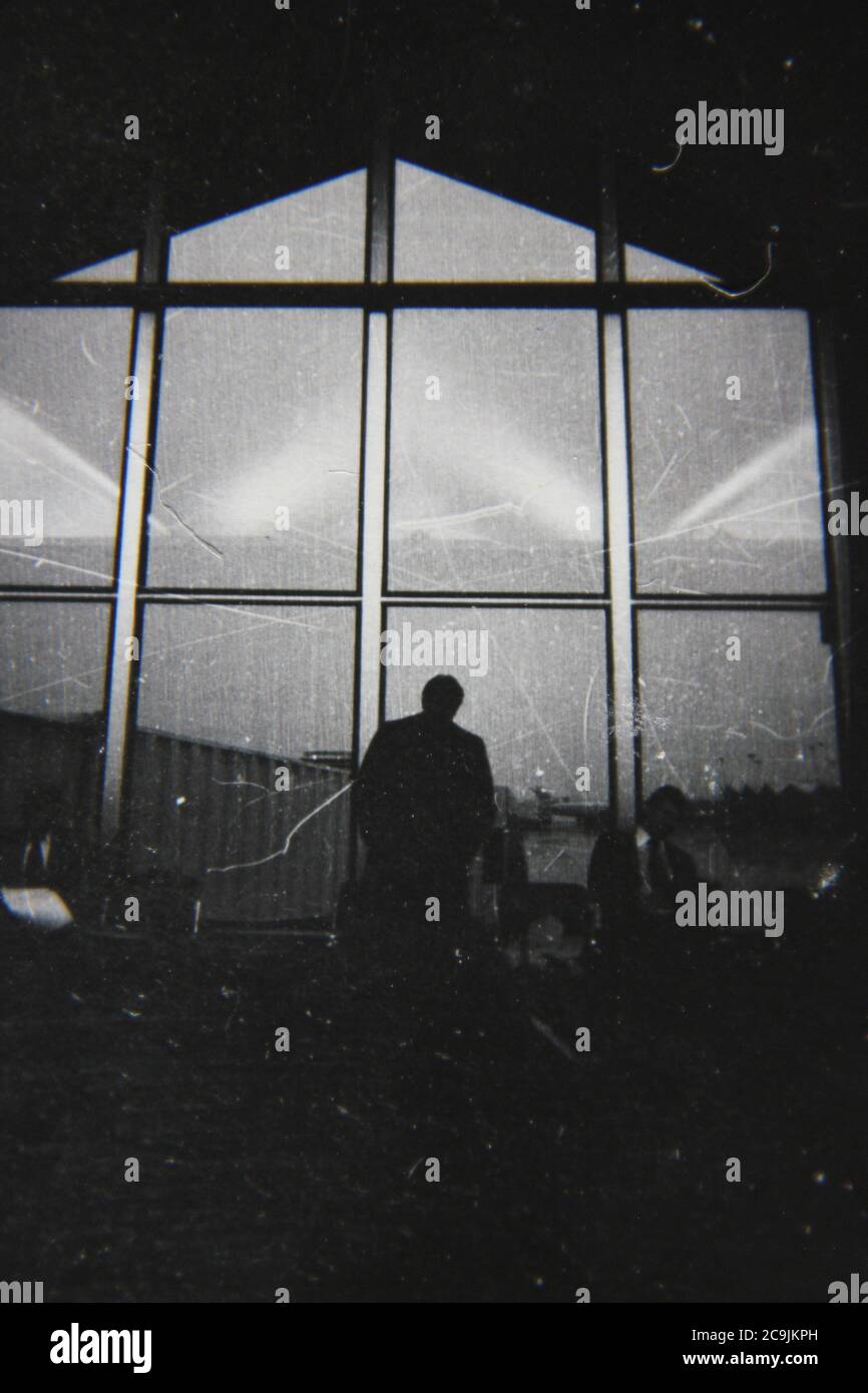 Fine 1970s vintage black and white photography of a huge window open to ...