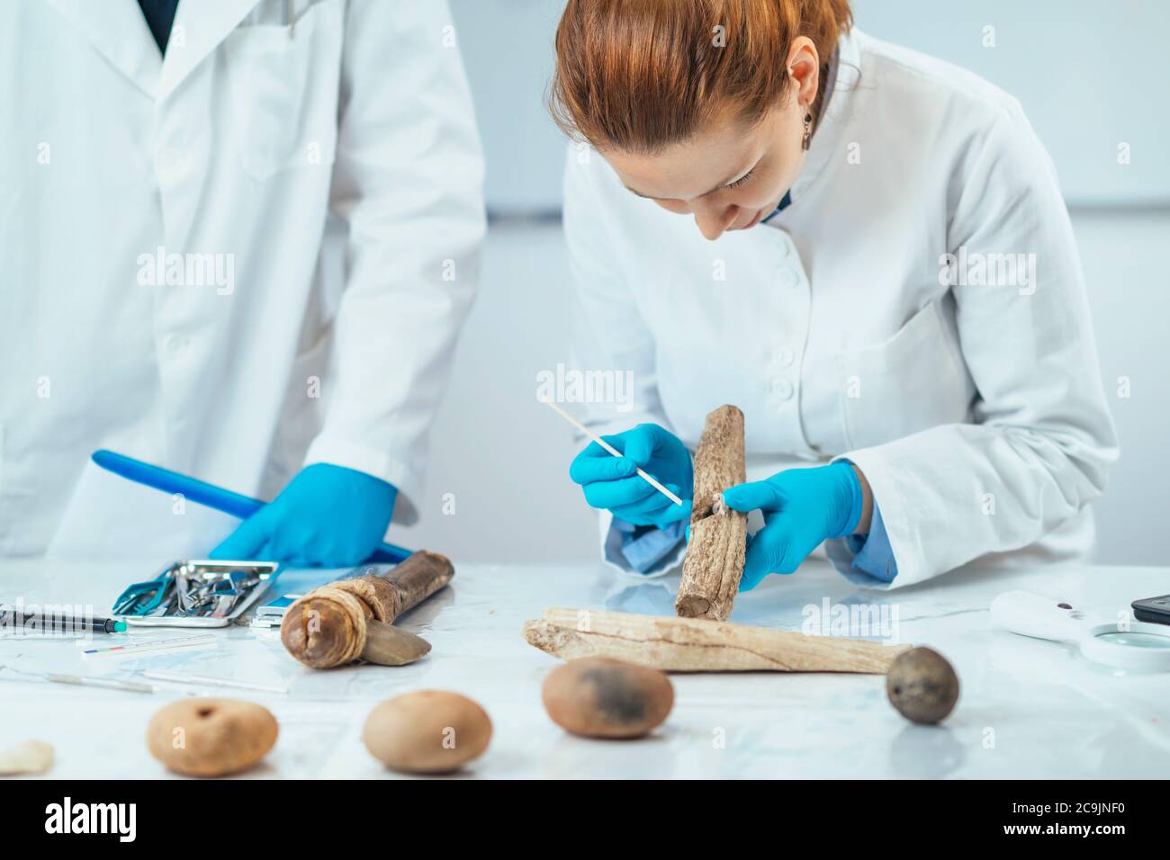 Archaeology researcher in laboratory reconstructs usage of ancient ...