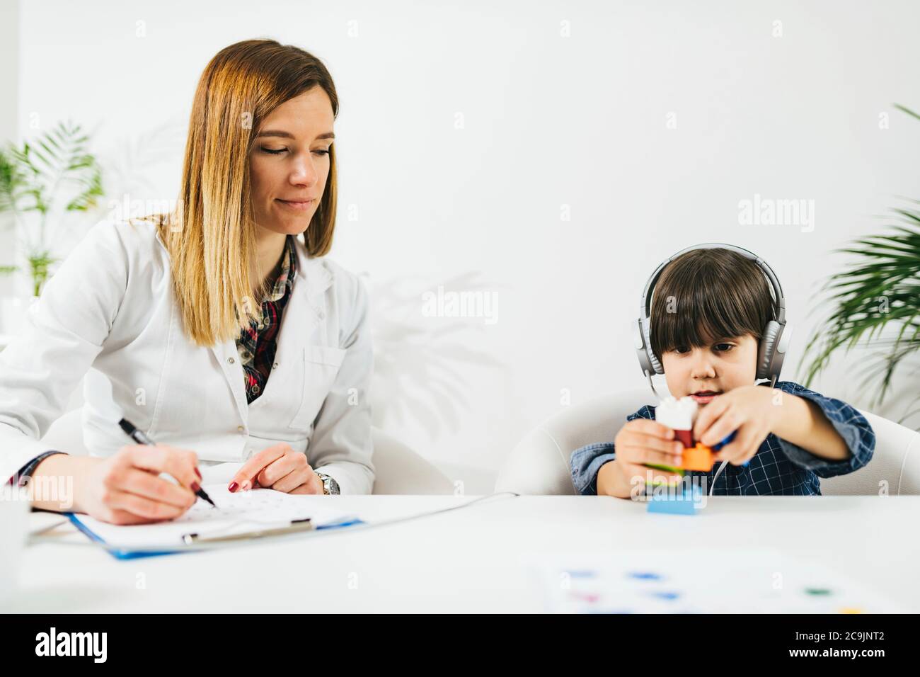 Hearing test for children. Little boy with audiologist Stock Photo - Alamy