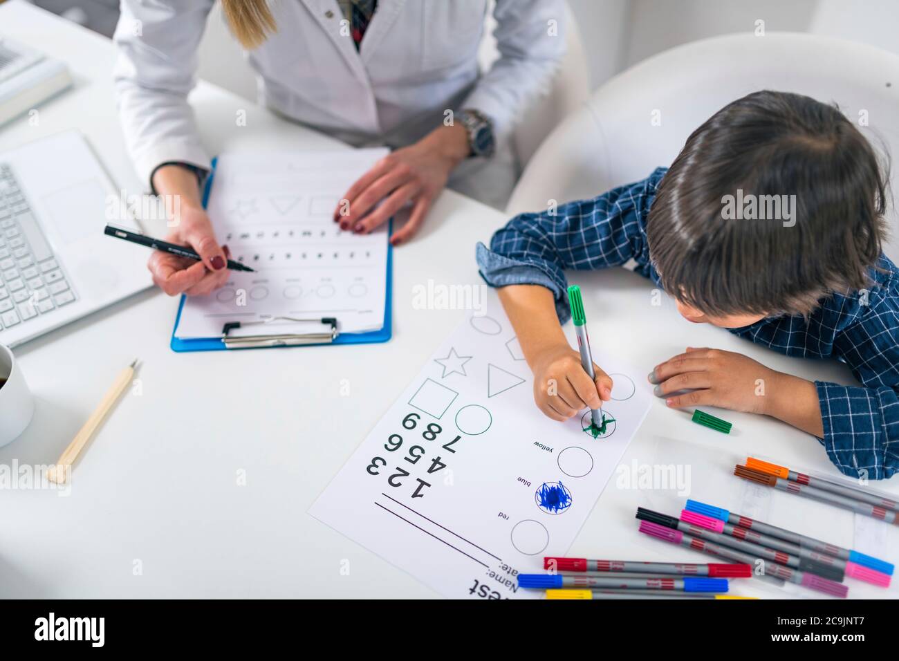 Psychology test for children. Toddler colouring shapes Stock Photo - Alamy