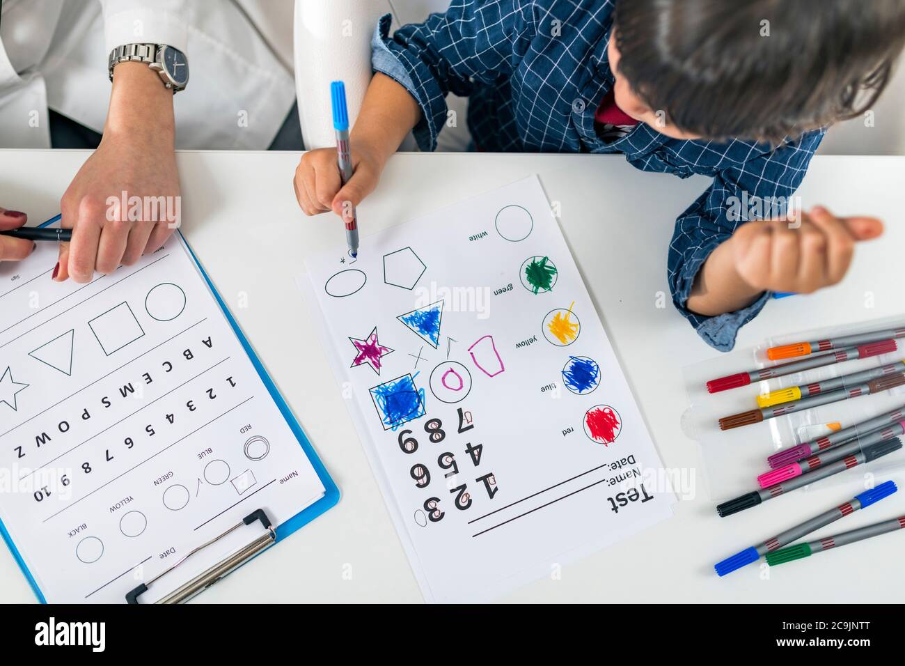 Psychology test for children. Toddler colouring shapes Stock Photo - Alamy