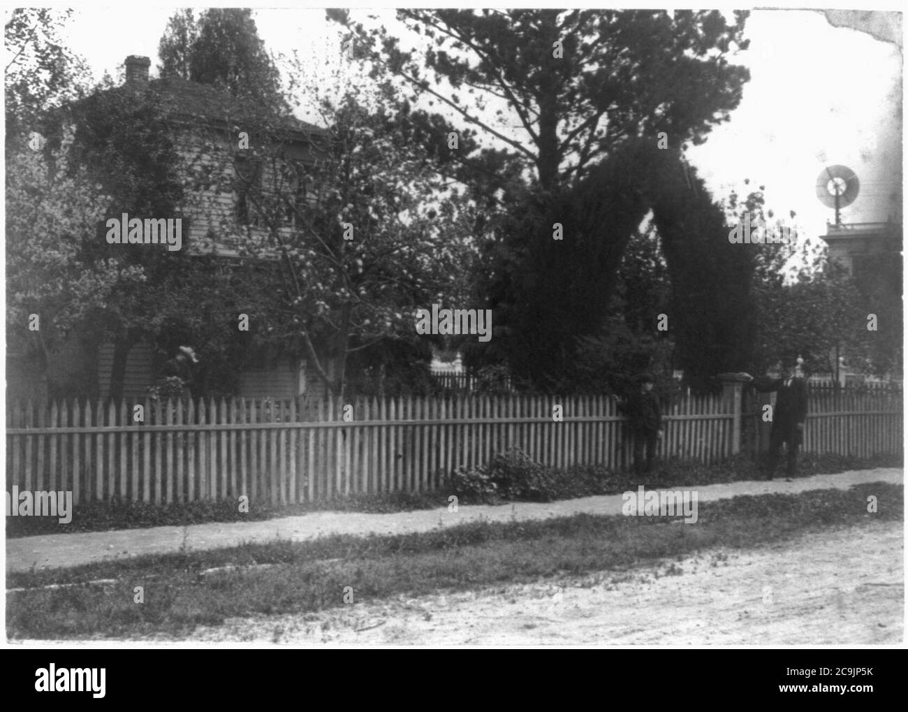 James Graham Cooper at gate to his home, Haywards, California, April ...