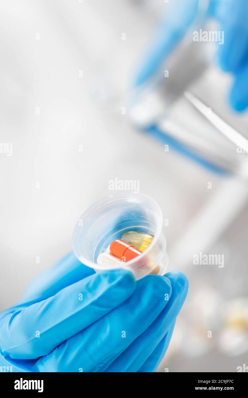 Graduated medicine cup hi-res stock photography and images - Alamy