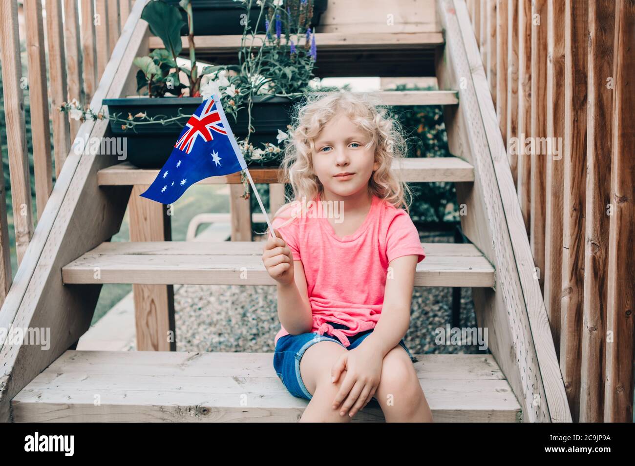 Adorable cute happy Caucasian girl holding Australian flag. Smiling ...