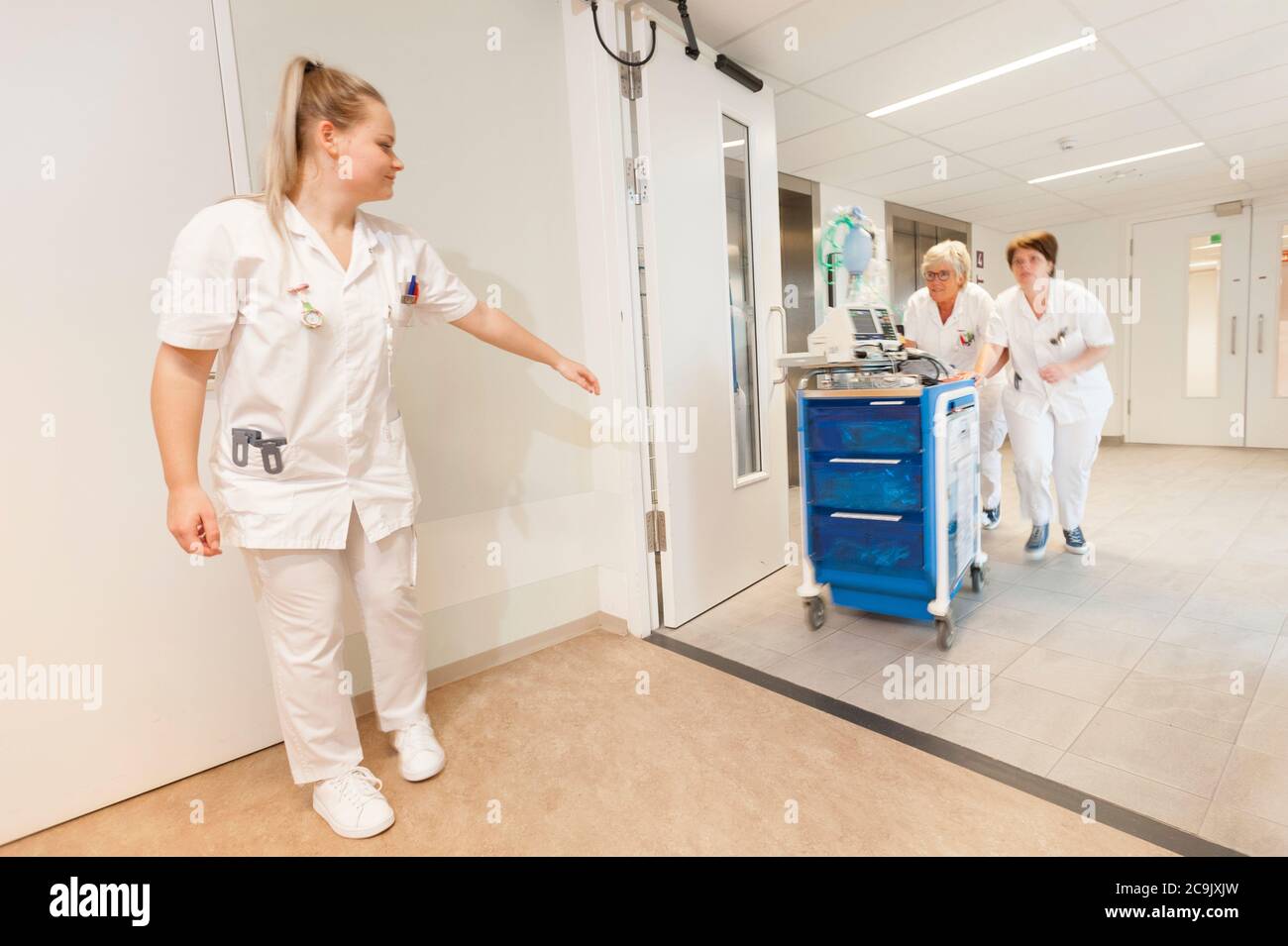 Geriatric hospital ward. Nurses running through the hall of a hospital ...