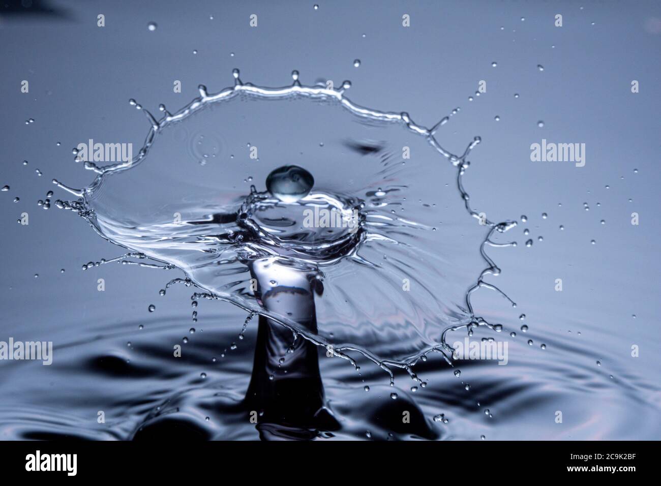 Water drop impact Stock Photo - Alamy